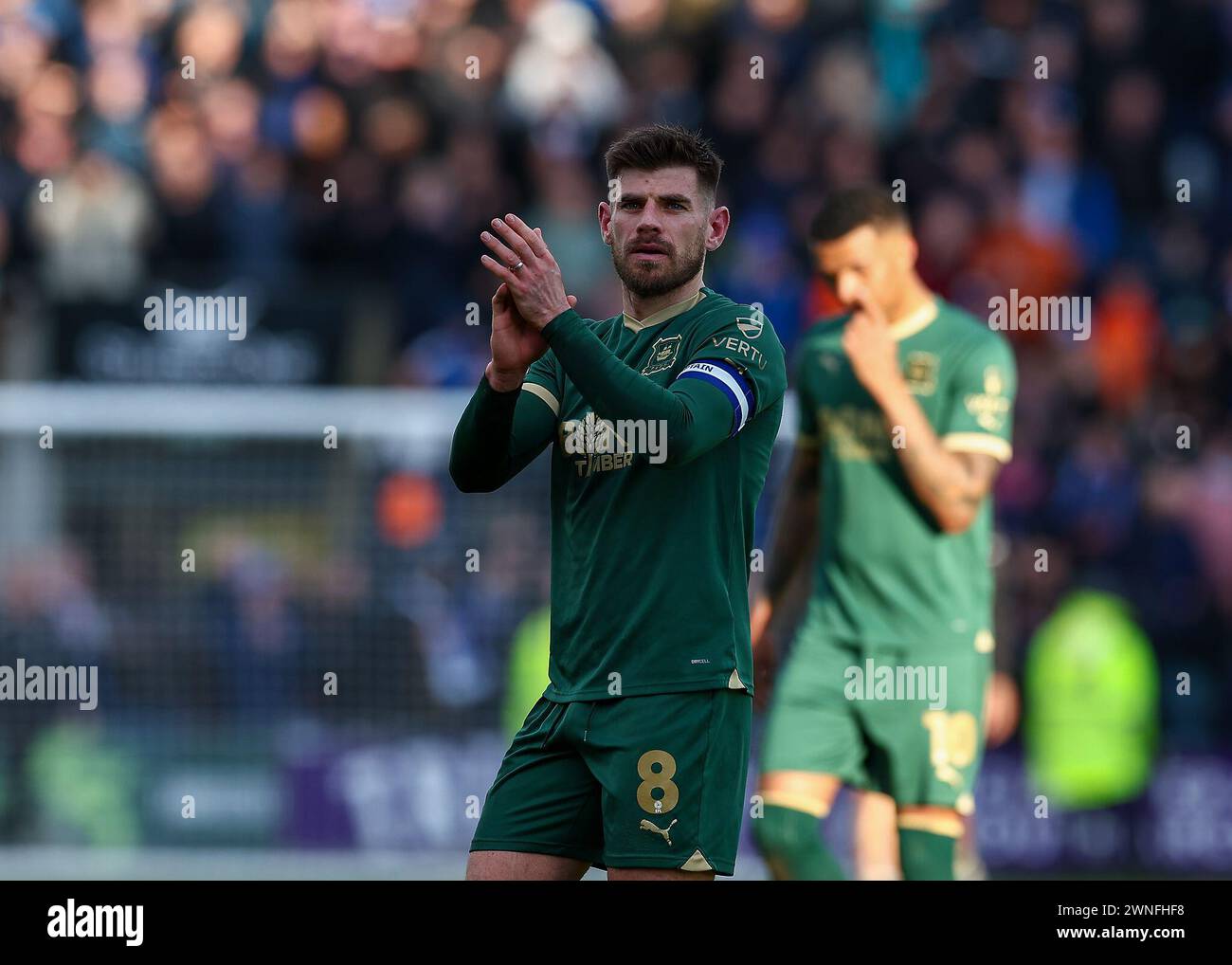 Joe Edwards of Plymouth Argyle applauds the fans at full time and looks ...