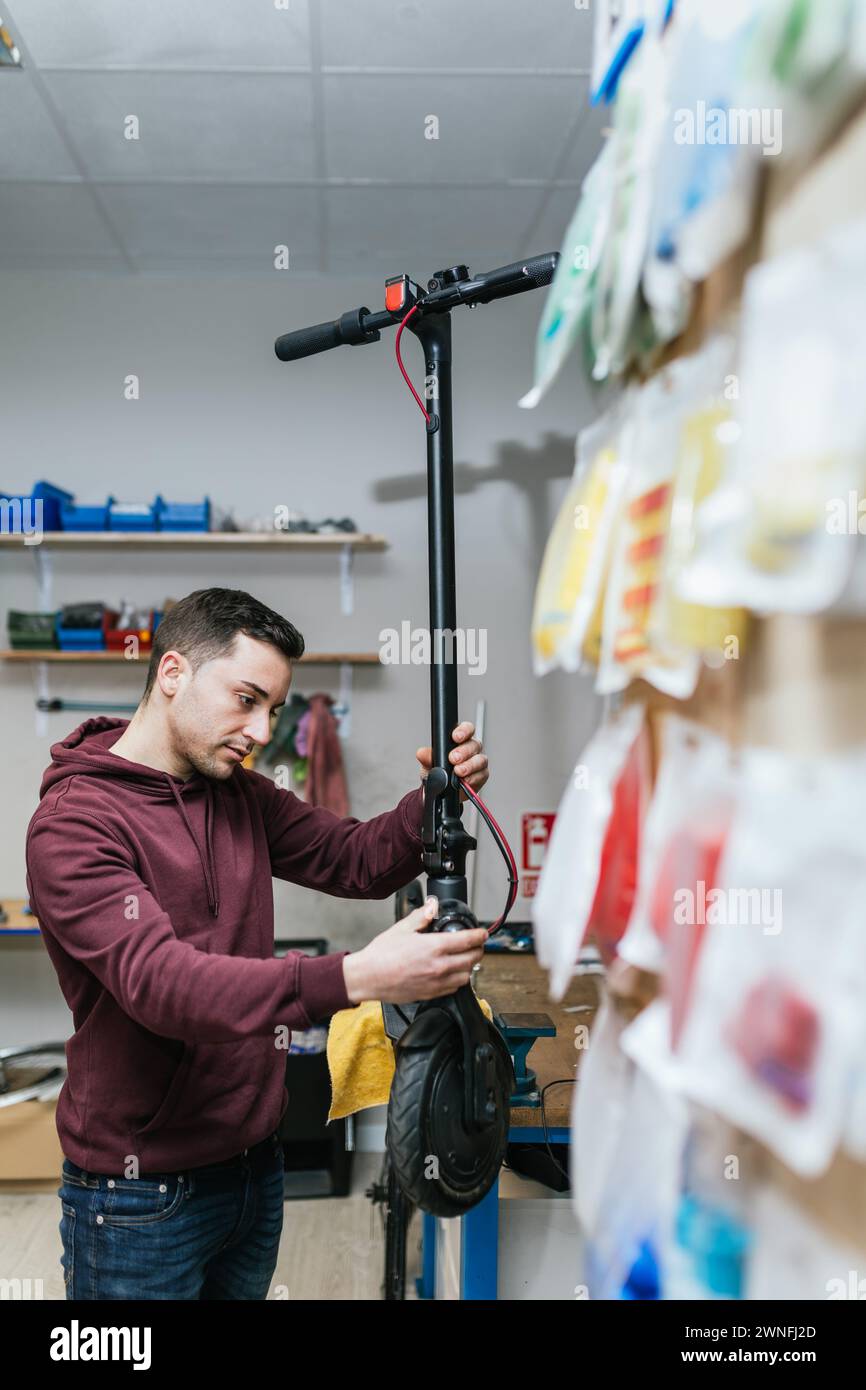 Mechanic repairing scooter hi-res stock photography and images - Alamy