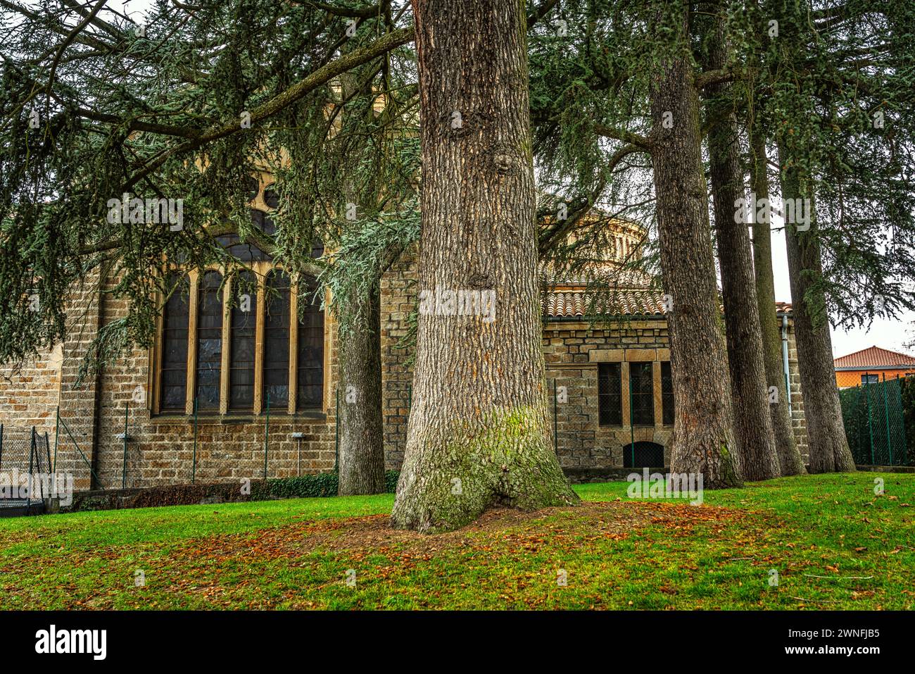 The apses of the church of Roche la Moliere overlooking the city castle ...
