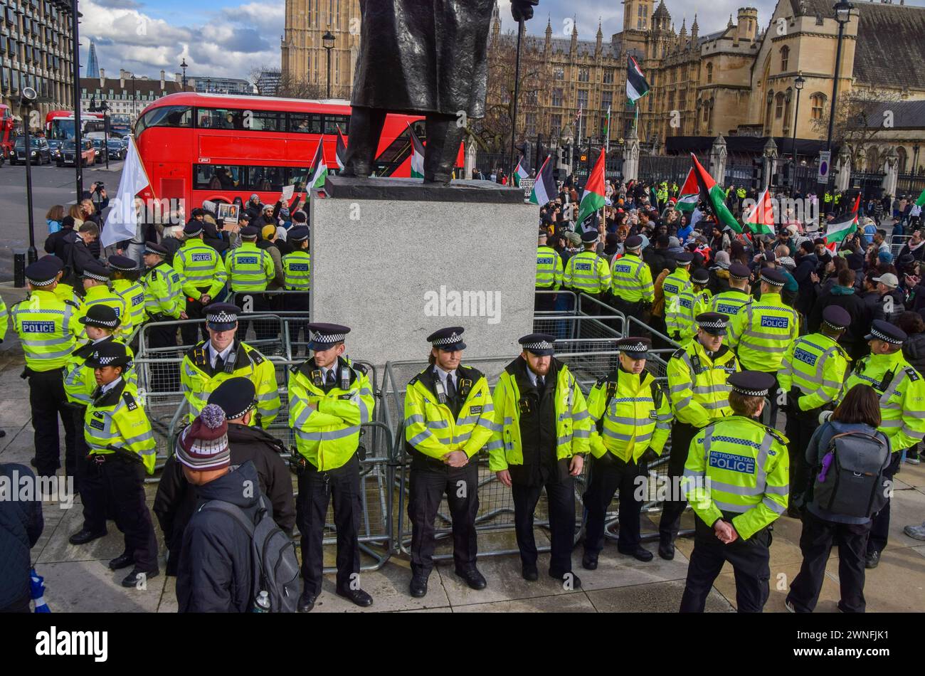 London, England, UK. 2nd Mar, 2024. Police officers guard the statue of ...