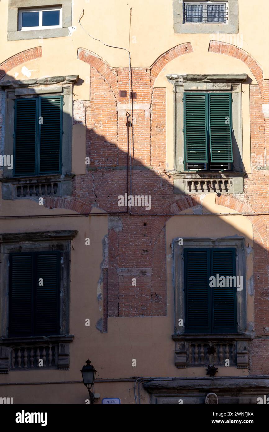 Exterior of typical Italian buildings in Lucca, Tuscany, Italy Stock ...