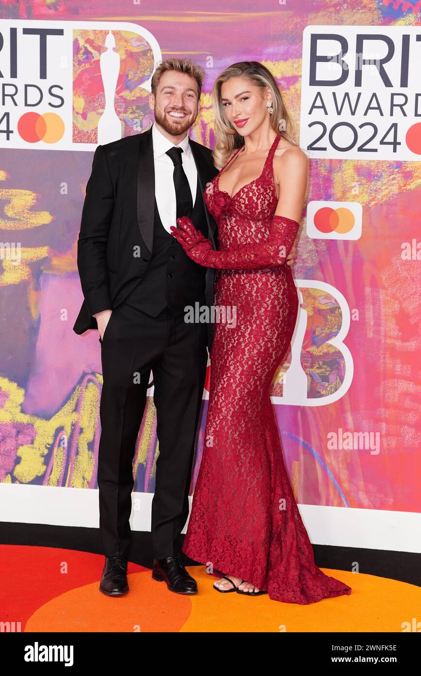 Zara McDermott (right) and Sam Thompson attending the Brit Awards 2024 ...