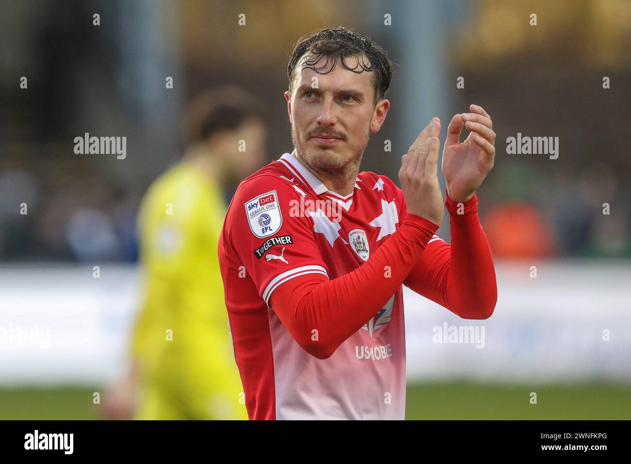 Josh Earl of Barnsley applauds the travelling fans after a 2-4 win ...