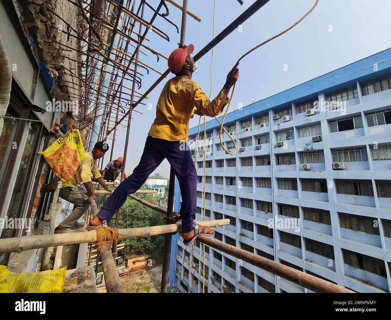 Men at work in high rise building hi-res stock photography and images ...