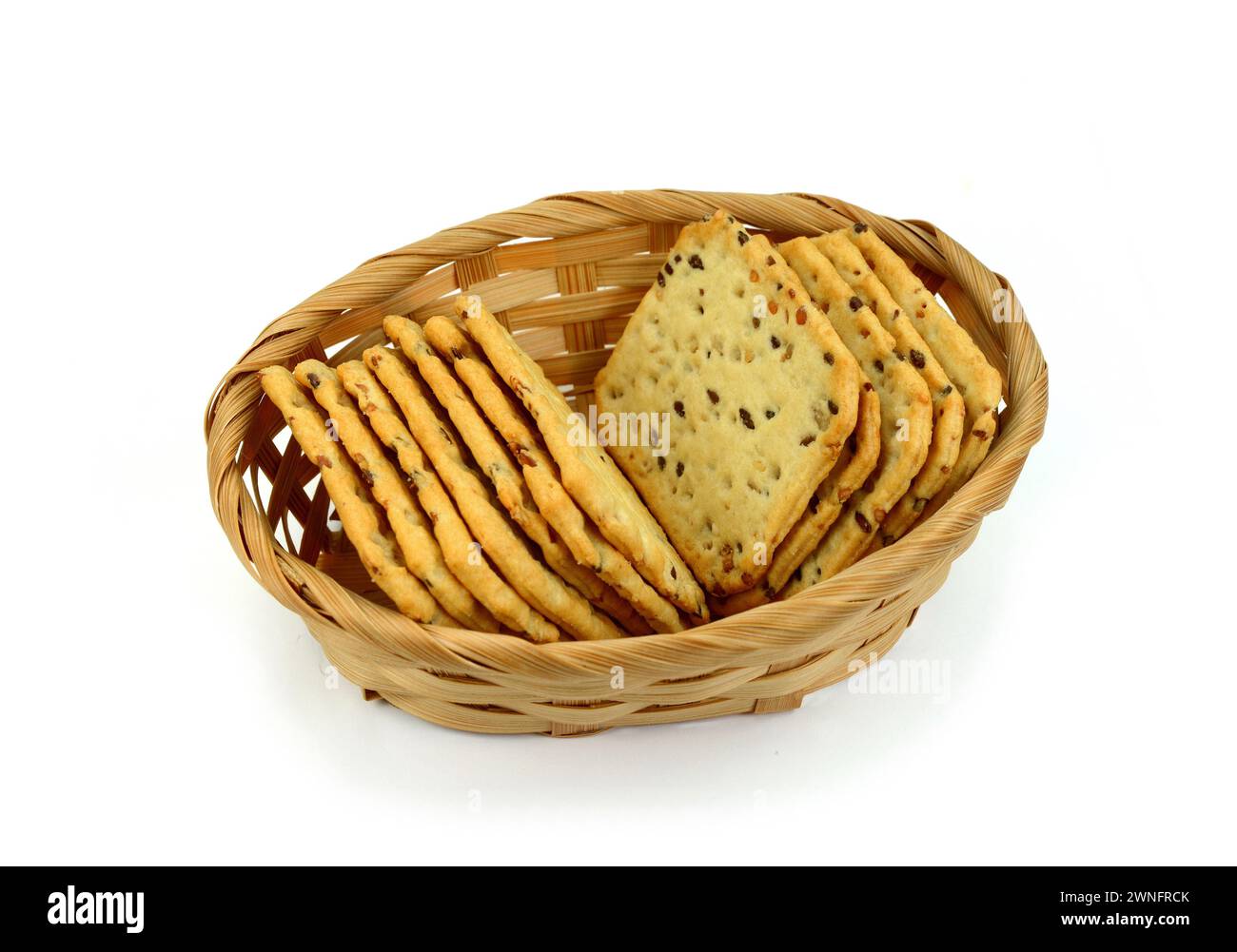 multigrain flatbread crackers in a Heart Shaped wicker basket isolated ...