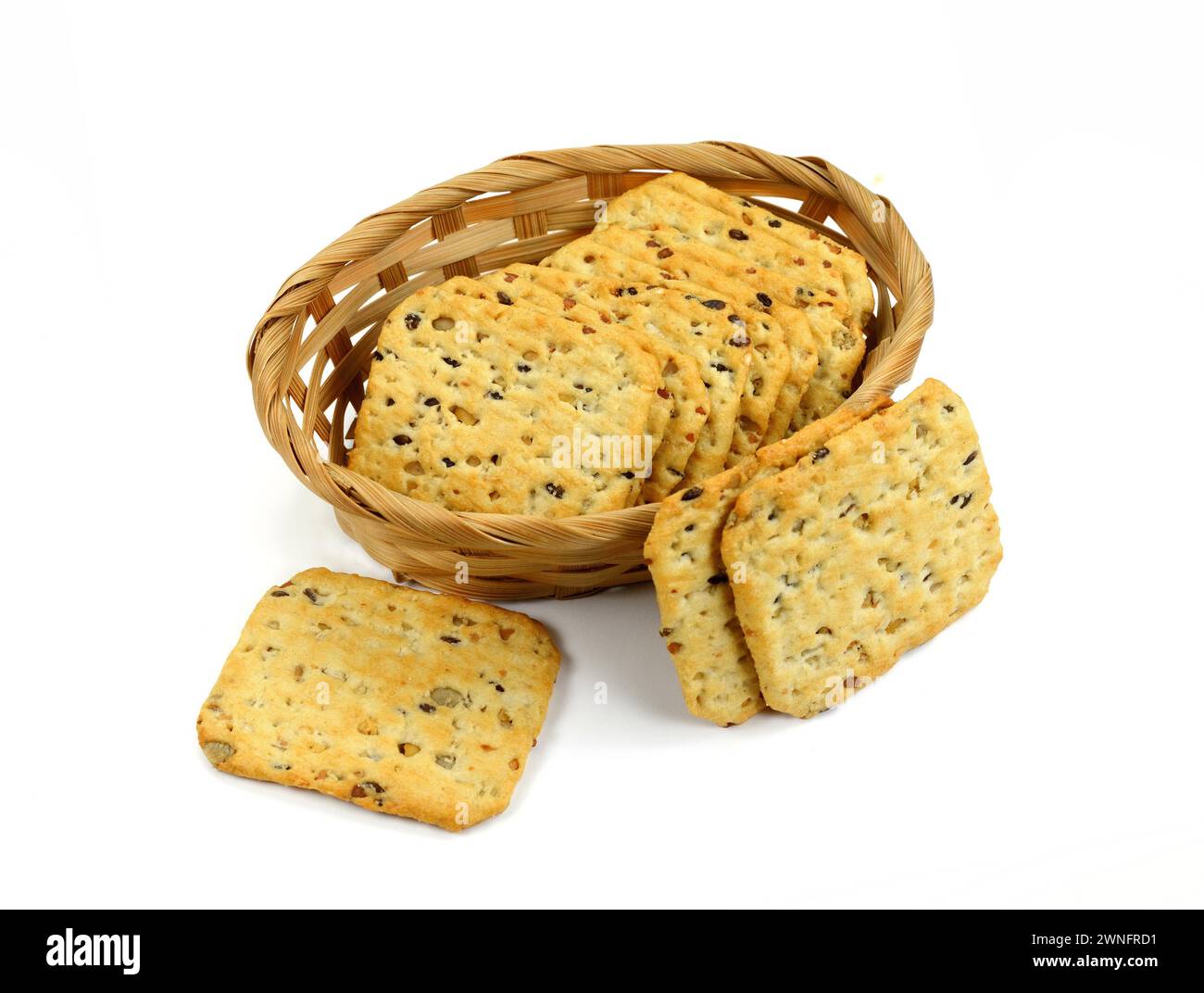 multigrain flatbread crackers in a Heart Shaped wicker basket isolated ...