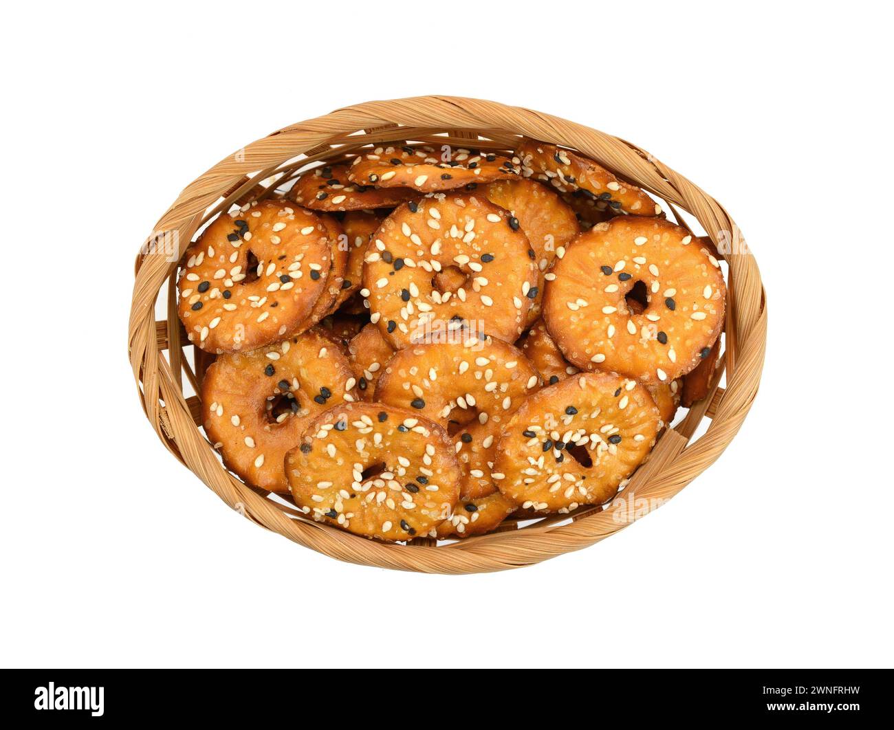 Salted round pretzels with black and white sesame isolated on white ...