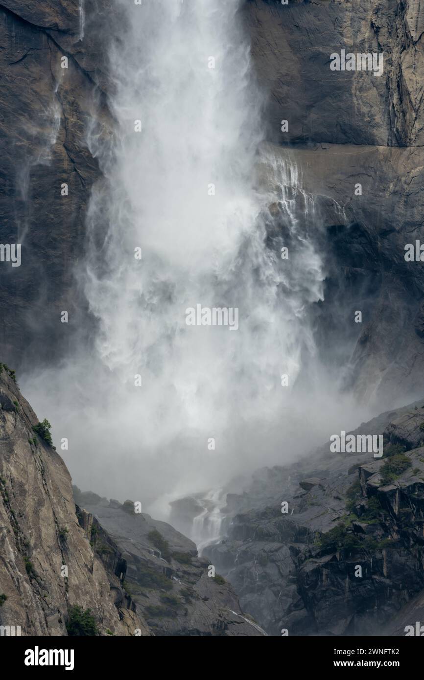Billowing Mist Of Yosemite Falls Crashes Into The Surrounding Granite ...