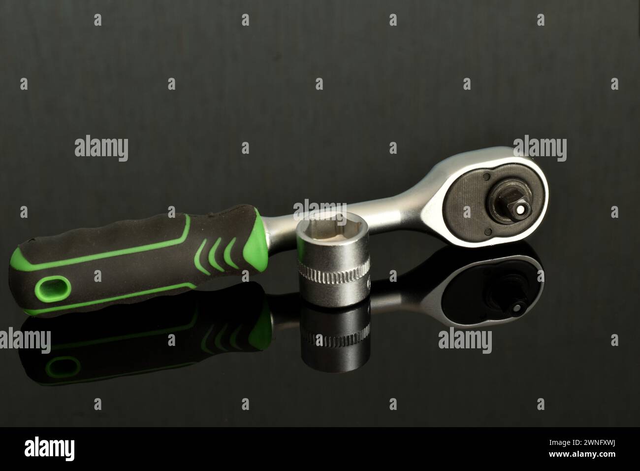 Socket wrench with ratchet with one head on a dark background Stock ...