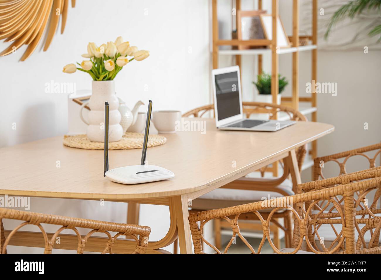 Modern wi-fi router on dining table in light room Stock Photo - Alamy