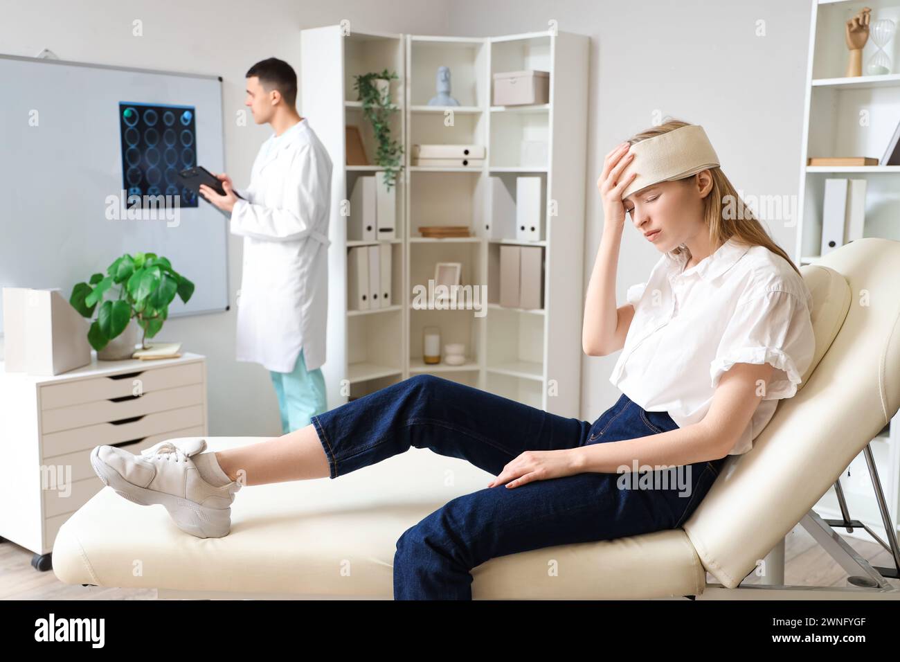Young woman with brain concussion at neurologist's office Stock Photo ...