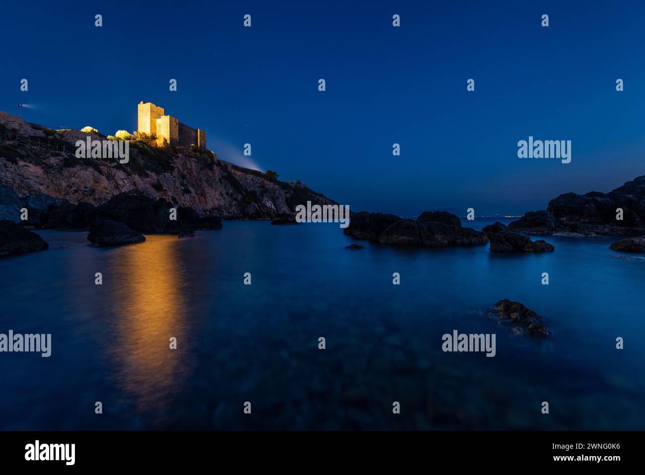 The Rocca Aldobrandesca castle on the rocky coast of Maremma in ...