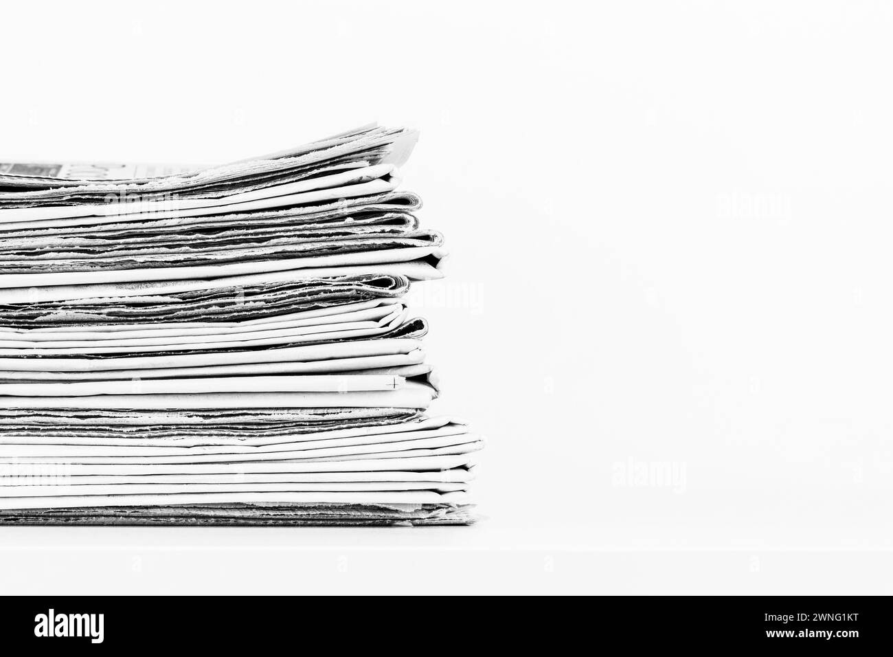 Stack of newspapers on table Black and White Stock Photos & Images - Alamy
