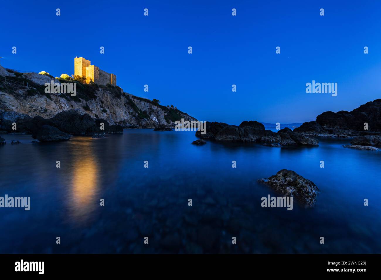 The Rocca Aldobrandesca castle on the rocky coast of Maremma in ...