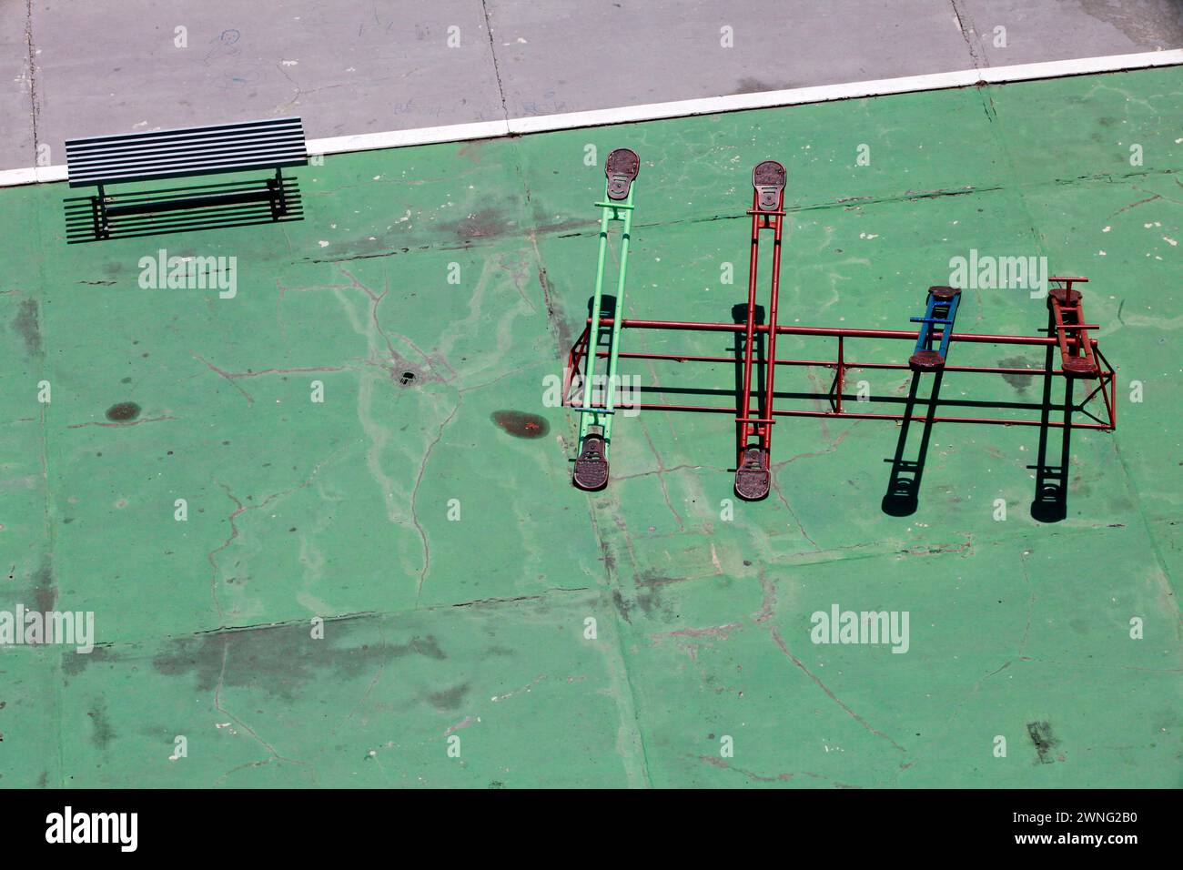 old and abandoned playground with seesaw and bench Stock Photo - Alamy
