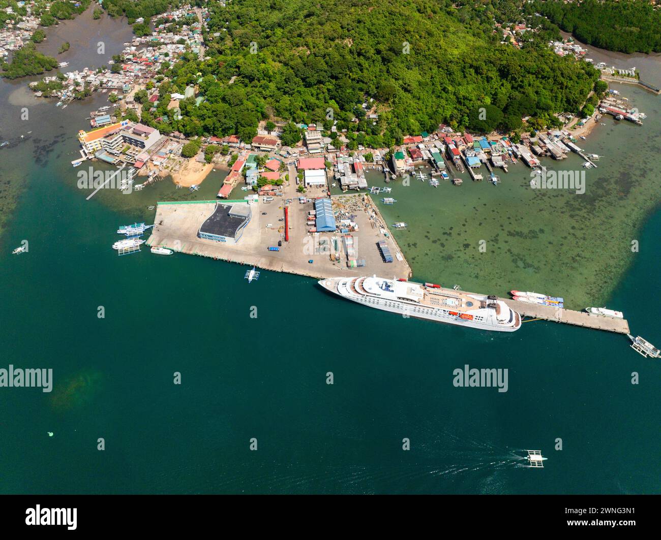 Drone view of Coron Port with Ferry and turquoise water. Coron, Palawan ...