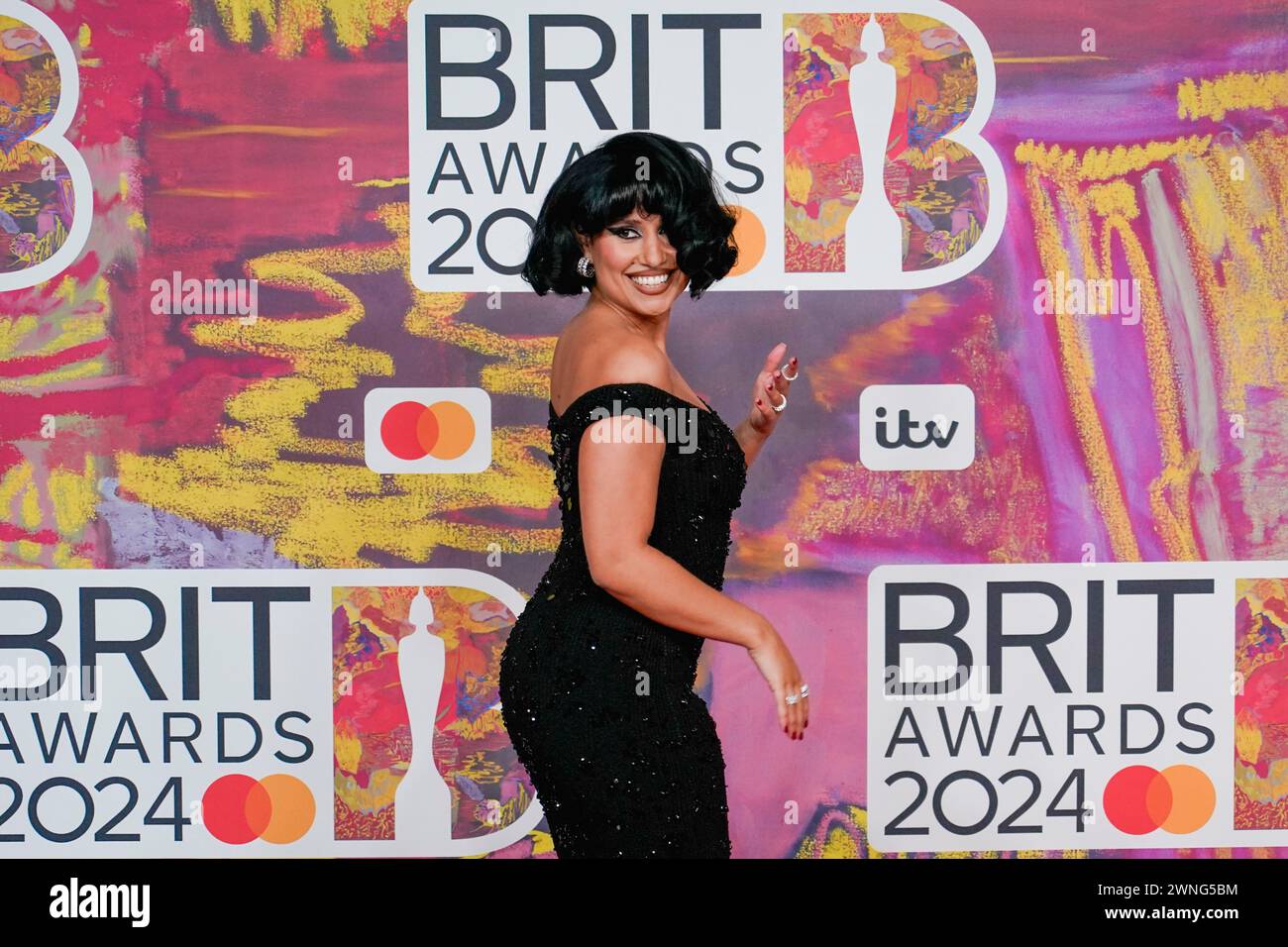 Raye poses for photographers upon arrival at the Brit Awards 2024 in ...