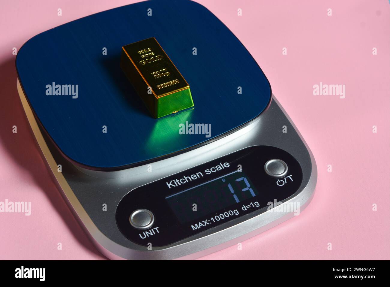 Digital scales that are weighing chocolate, strawberries and several ...