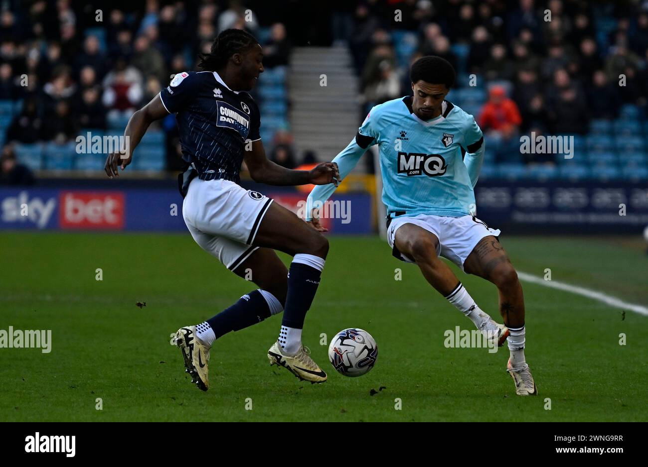 London, UK. 2nd Mar, 2024. Jamal Lewis (Watford) tries to go past ...