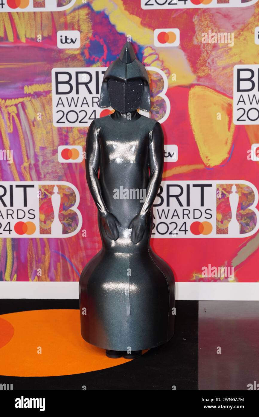 Guest dressed as the Brit Awards trophy attending the Brit Awards 2024 ...