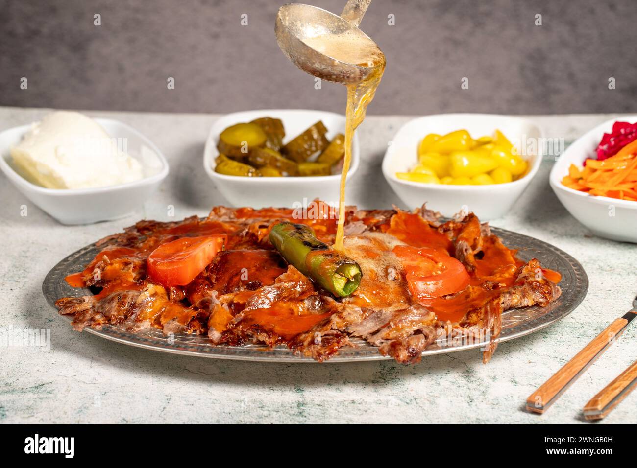 iskender kebab. Traditional Turkish cuisine flavor with tomato sauce ...