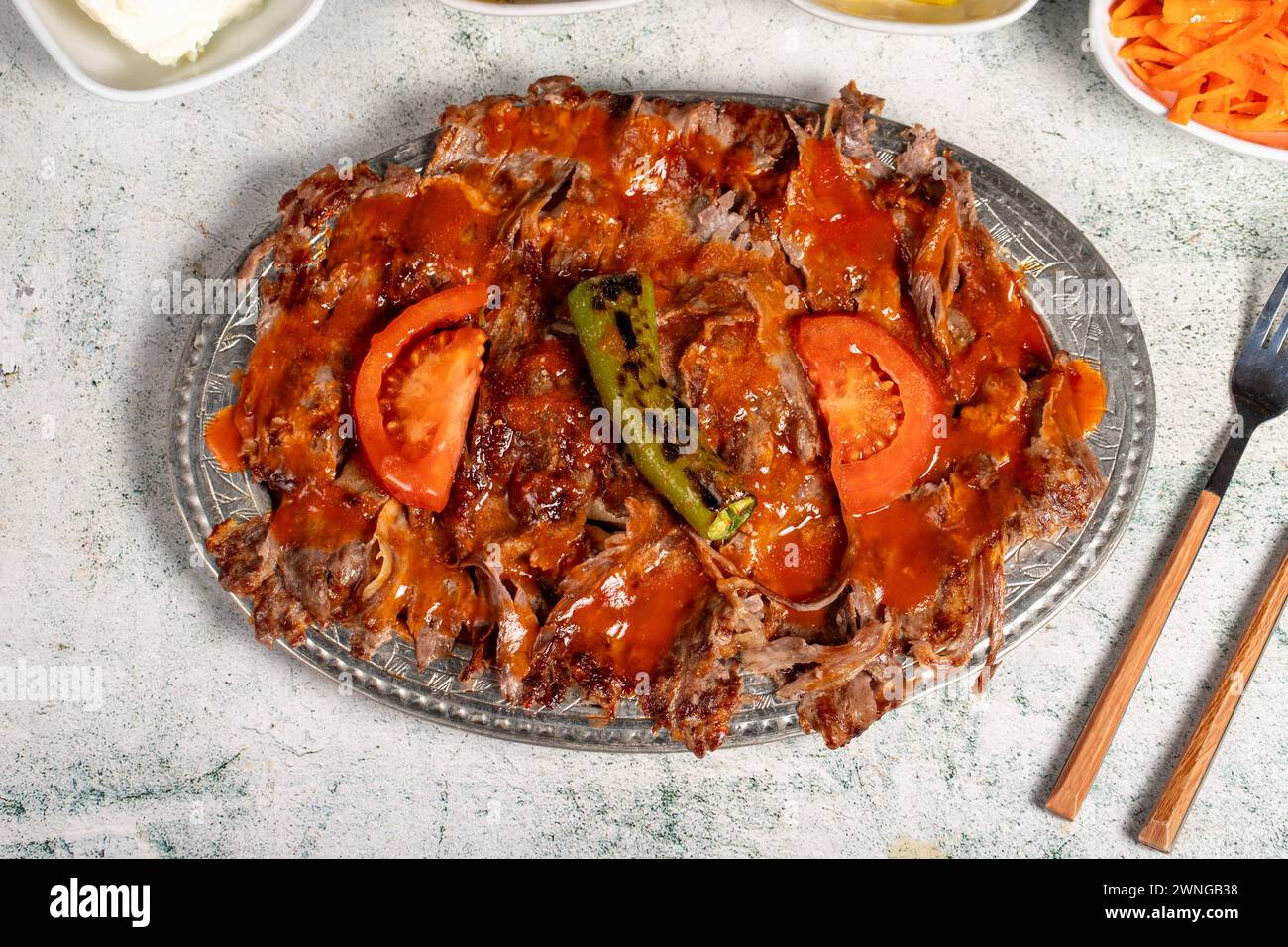 iskender kebab. Traditional Turkish cuisine flavor with tomato sauce ...