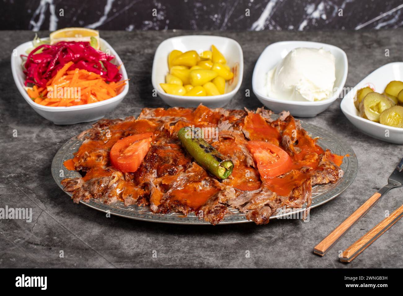 iskender kebab. Traditional Turkish cuisine flavor with tomato sauce ...