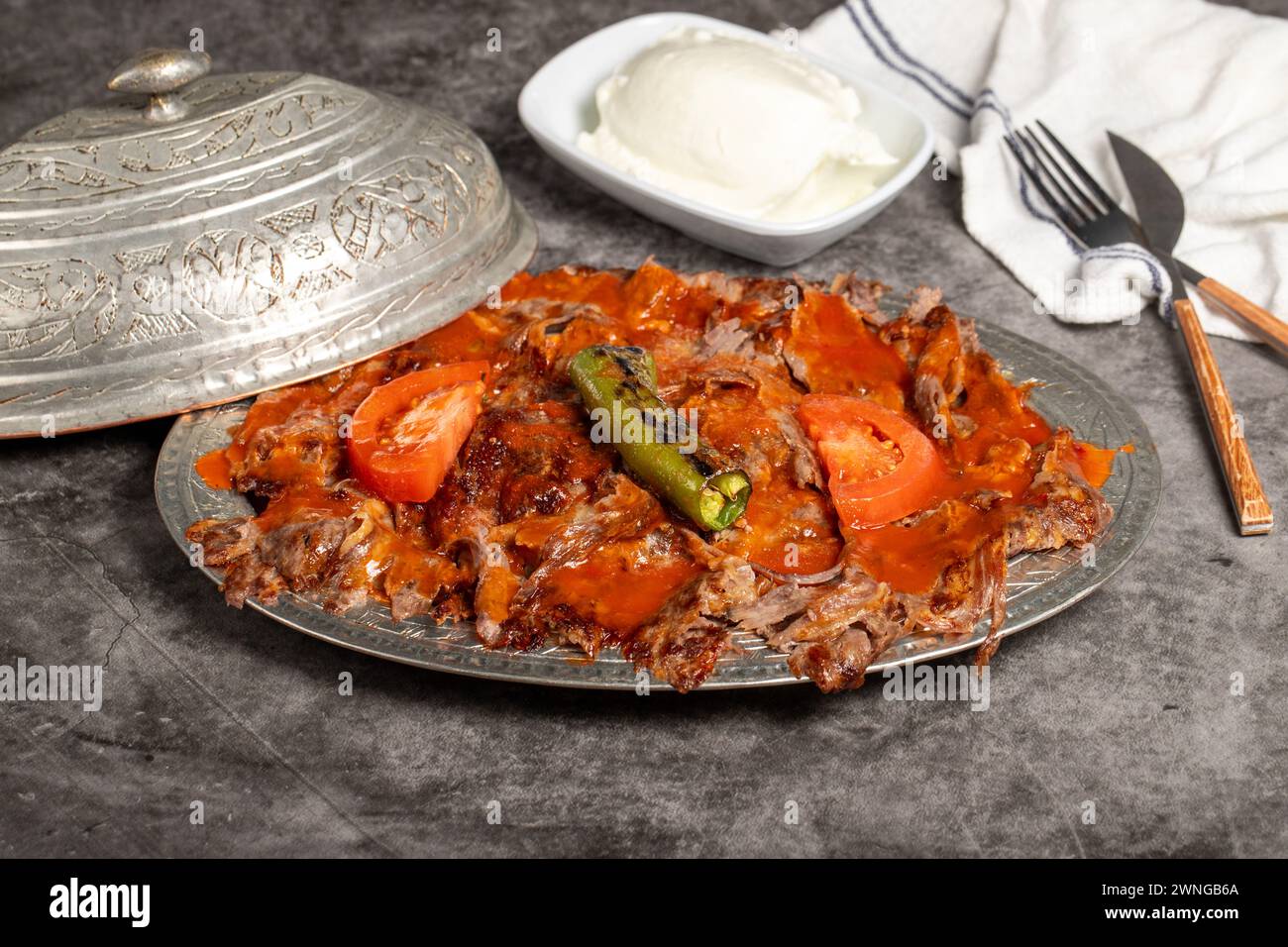 iskender kebab. Traditional Turkish cuisine flavor with tomato sauce ...