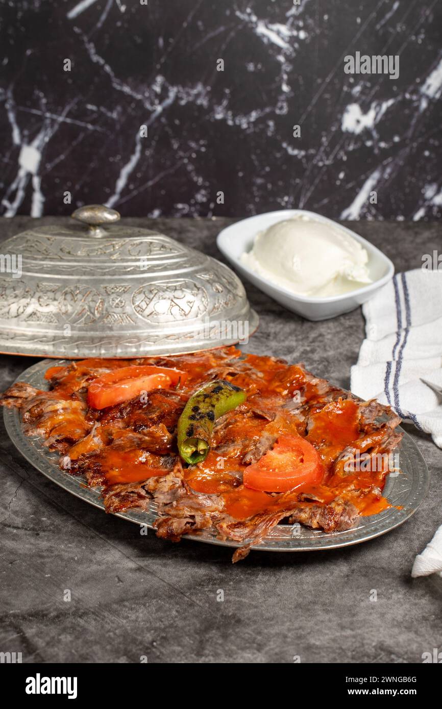 iskender kebab. Traditional Turkish cuisine flavor with tomato sauce ...