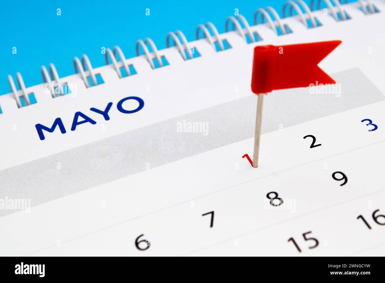 Flag shaped thumbtack marking International Workers' Day Stock Photo ...