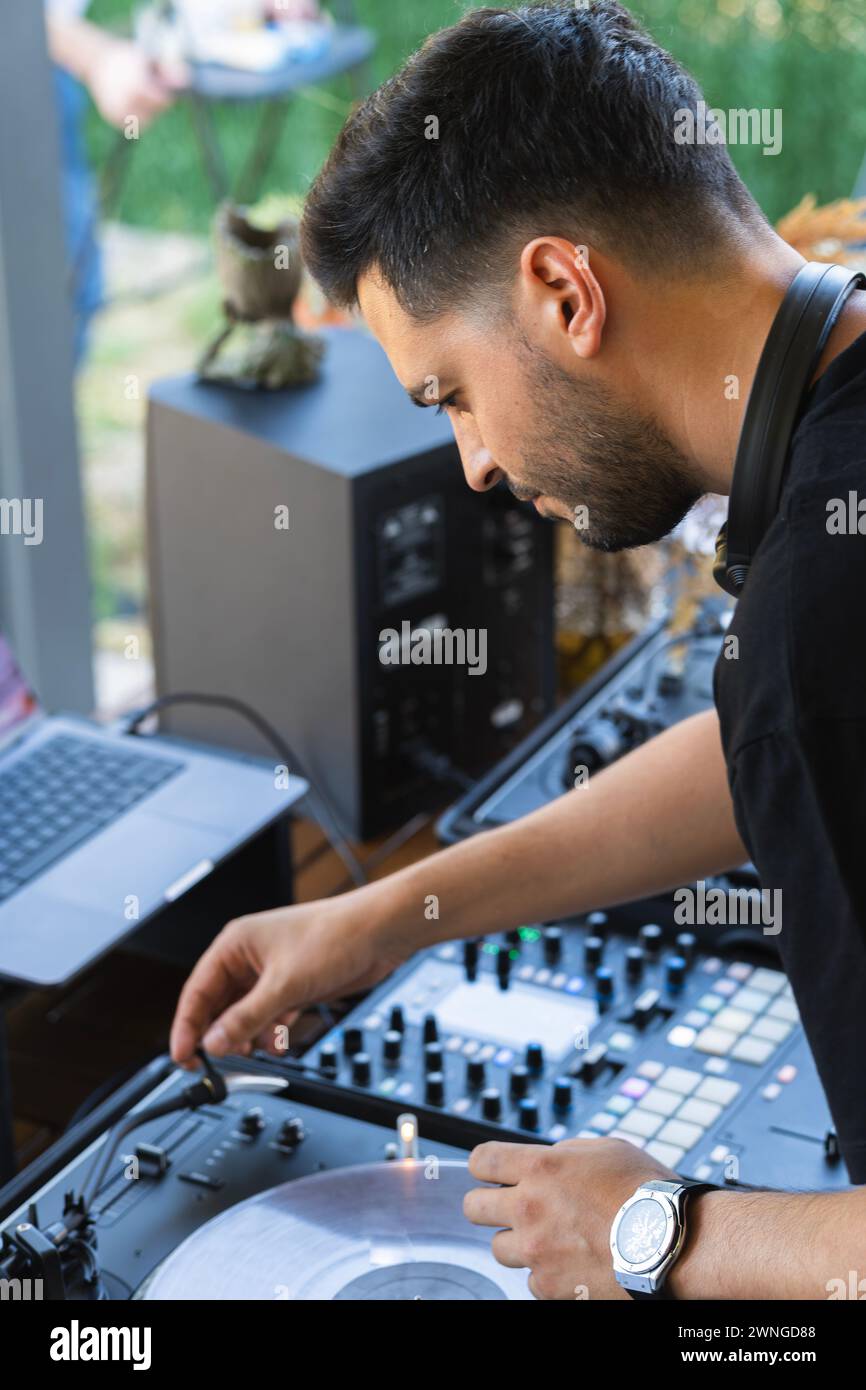 Sound engineer preparing the mixing console before starting the concert ...