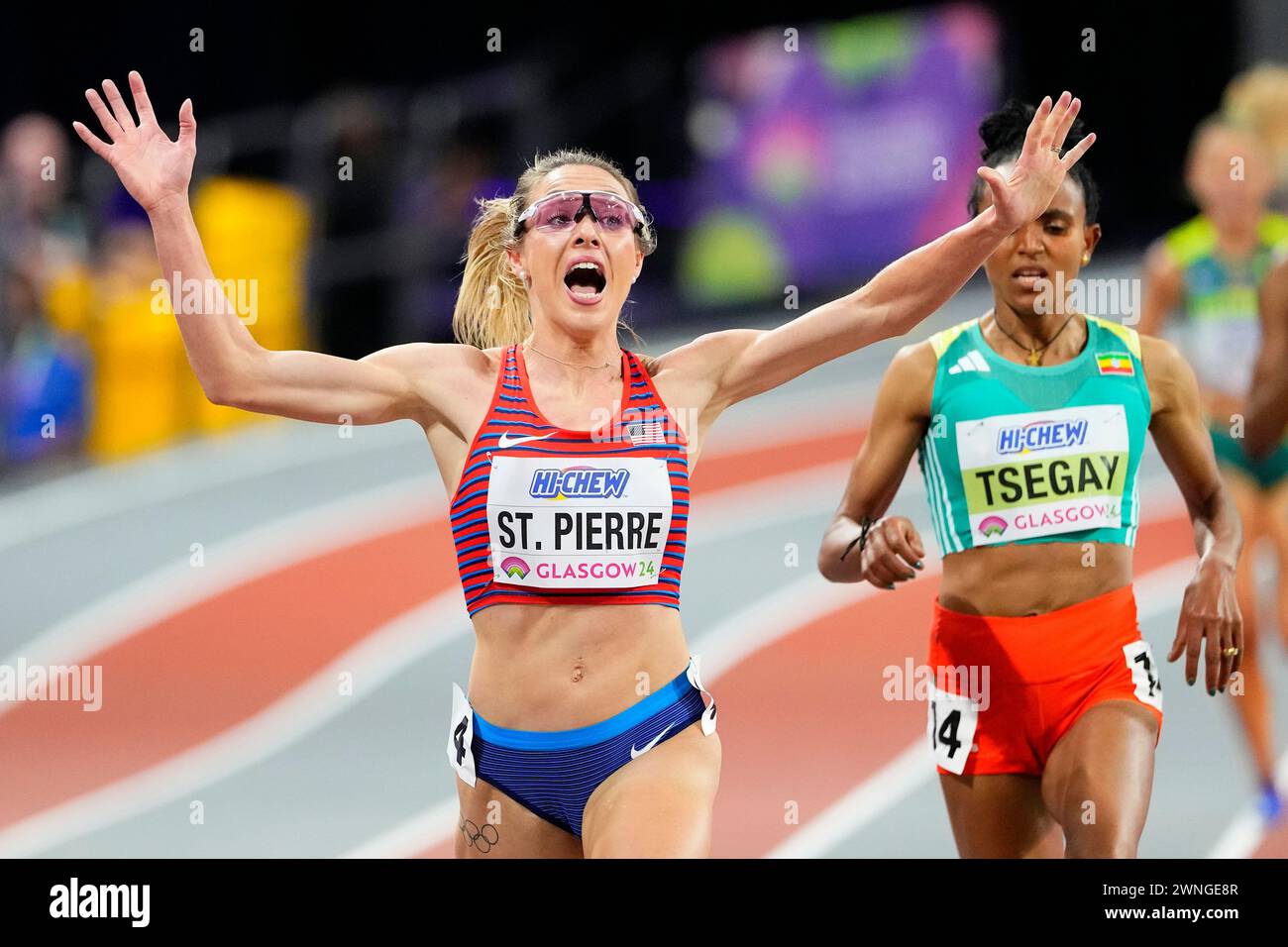 Elle St. Pierre, of the United States, crosses the finish line to win ...