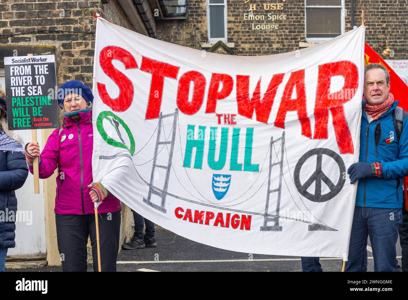 Brough, UK. 02 MAR, 2024. Two demonstrators hold Stop the War Hull ...