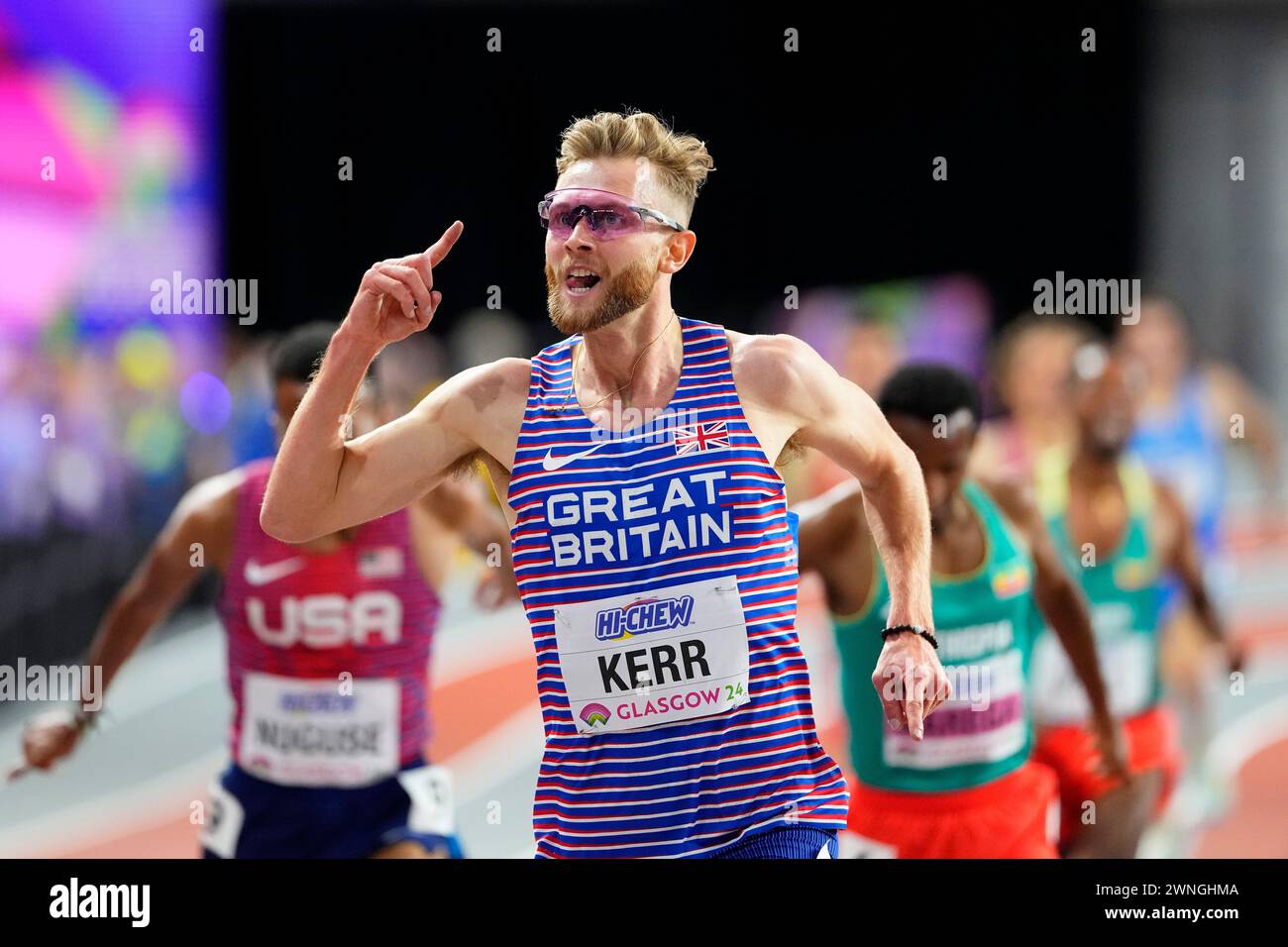 Josh Kerr, of Great Britain, crosses the finish line to win the gold ...