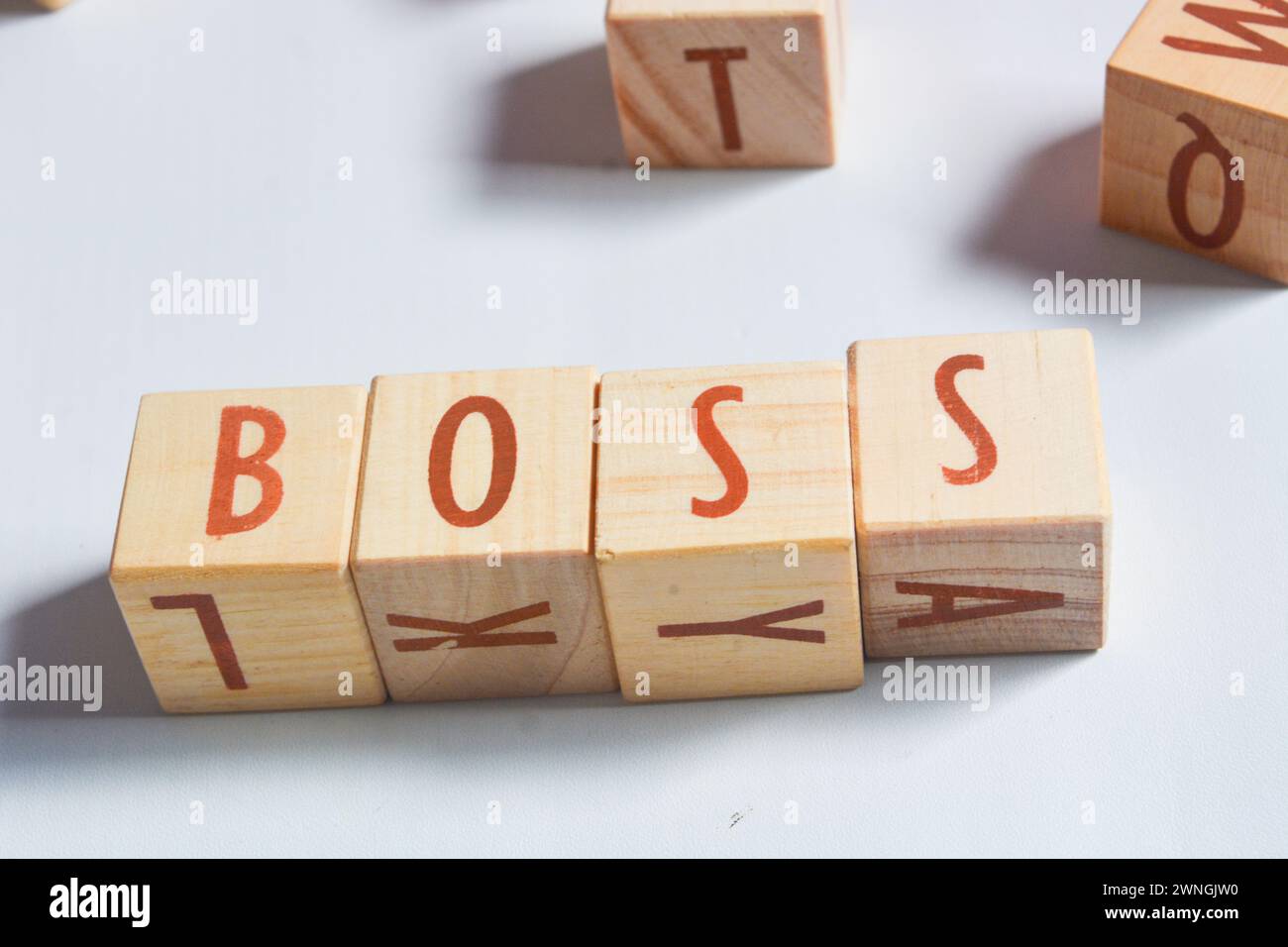 English vocabulary "BOSS" with medium brown wooden blocks, pink and ...