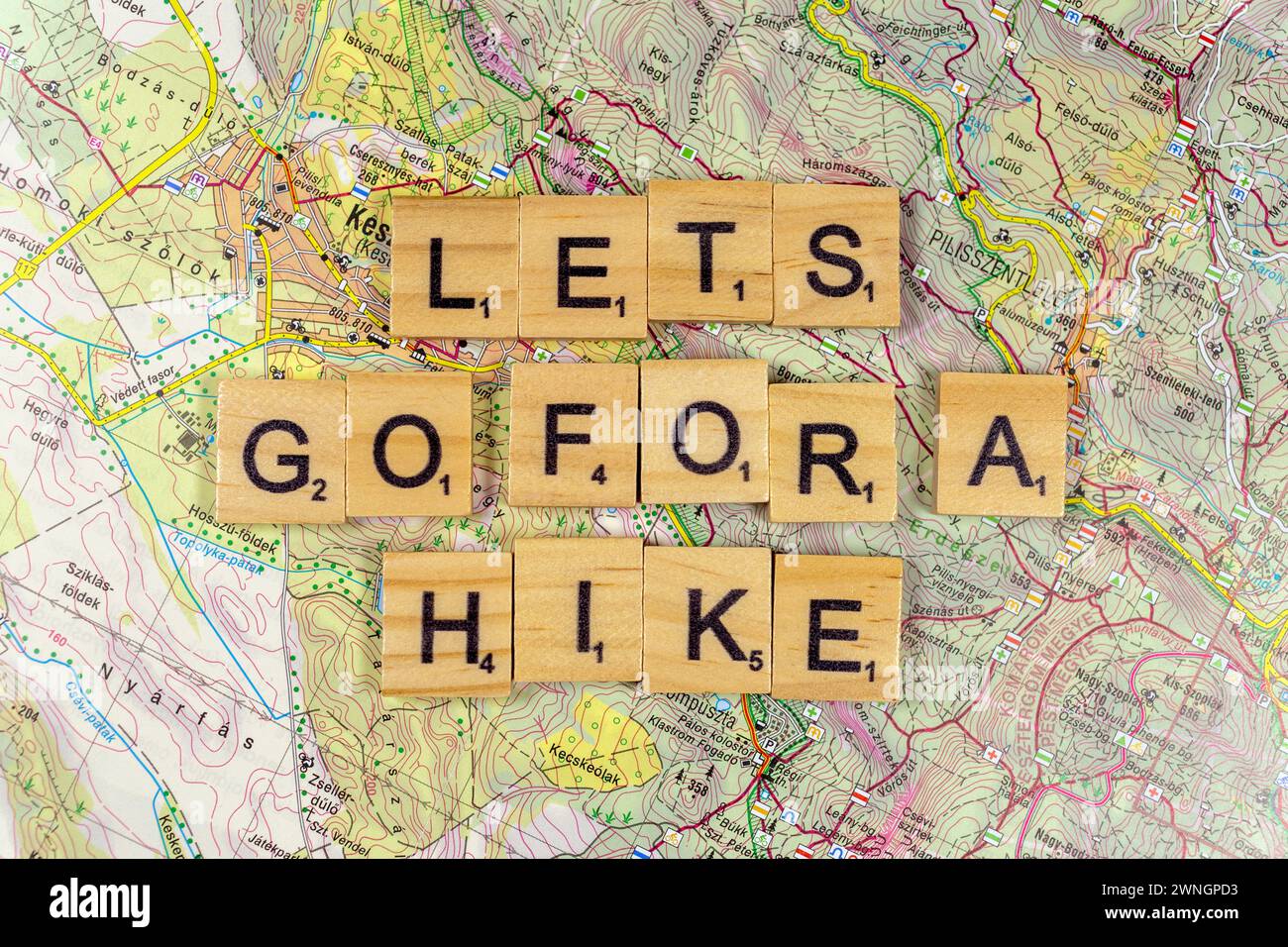 "Let's go for a hike" wooden letters on an old paper map Stock Photo ...