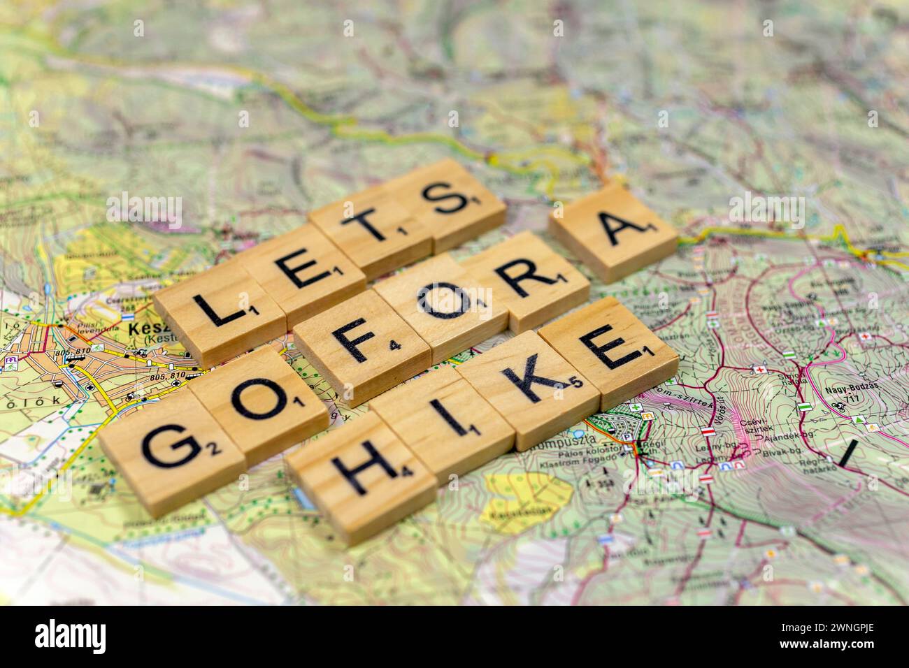 "Let's go for a hike" wooden letters on an old paper map Stock Photo ...