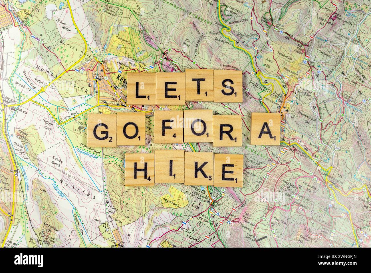 "Let's go for a hike" wooden letters on an old paper map Stock Photo ...