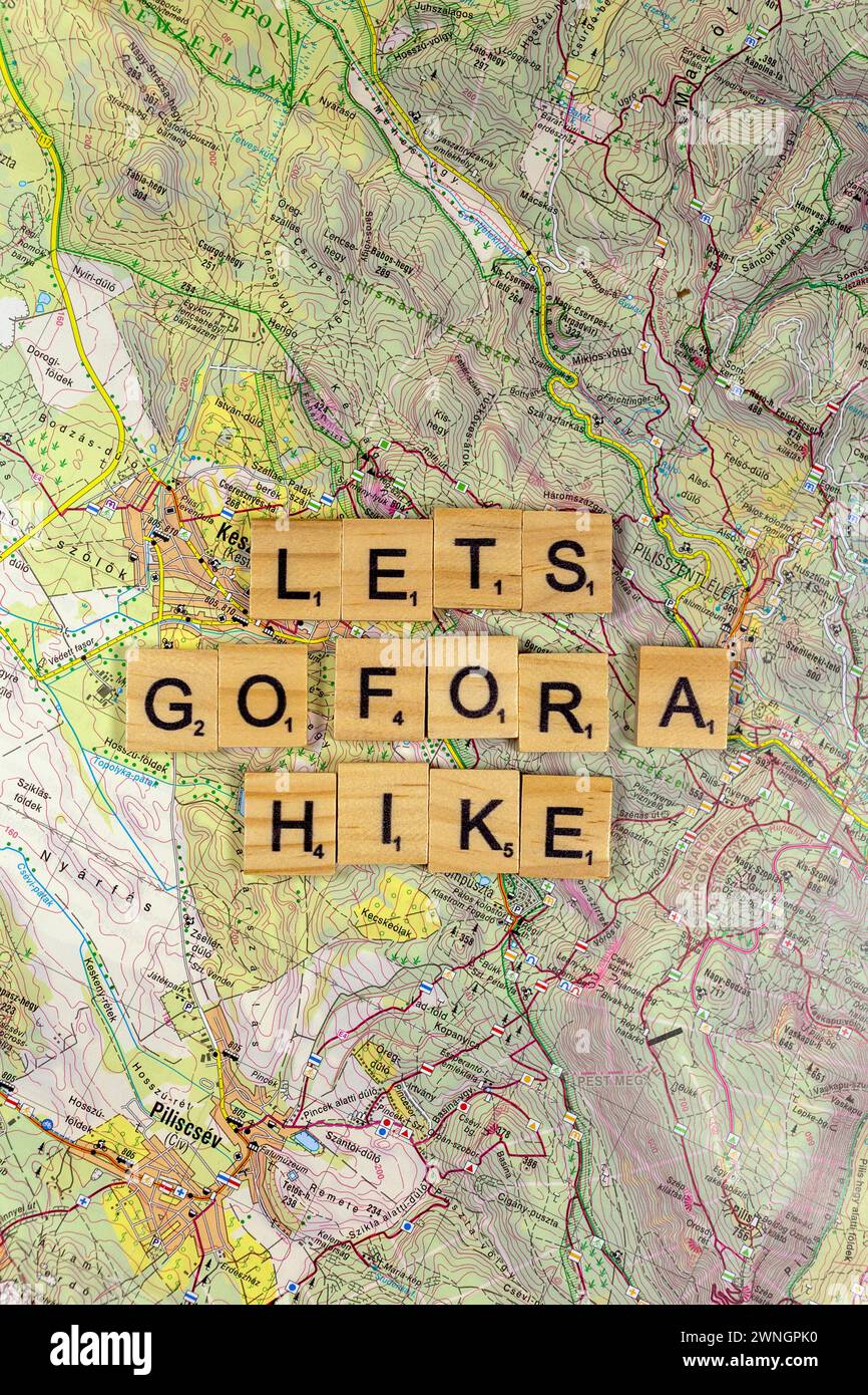 "Let's go for a hike" wooden letters on an old paper map Stock Photo ...