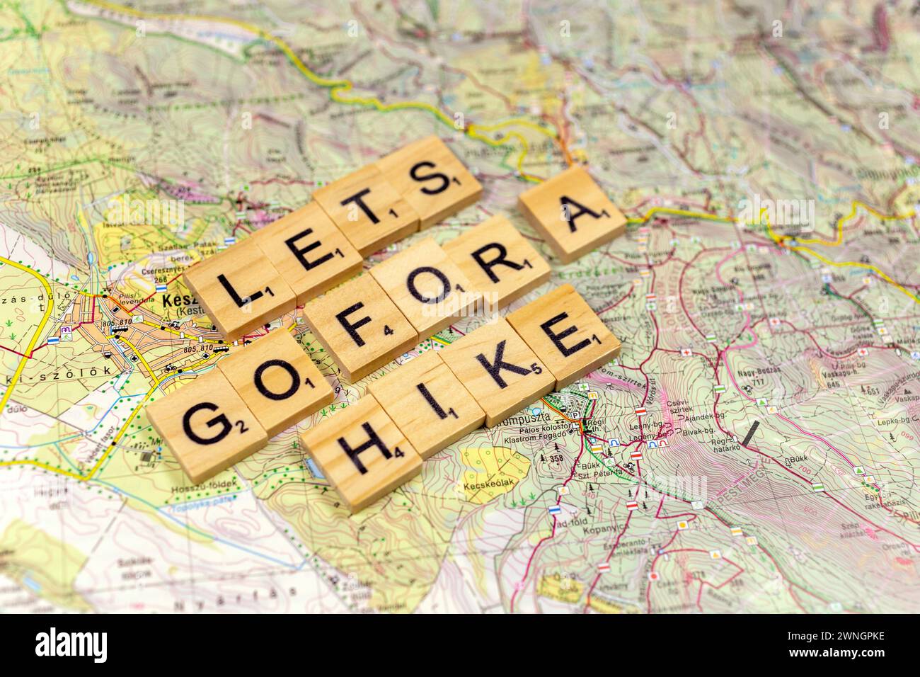 "Let's go for a hike" wooden letters on an old paper map Stock Photo ...