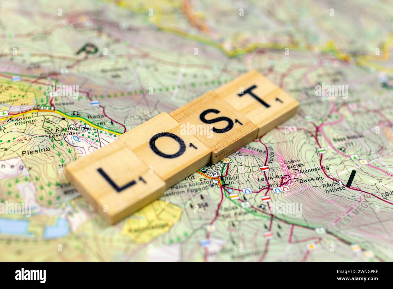 Lost wooden letters on an old paper map Stock Photo - Alamy