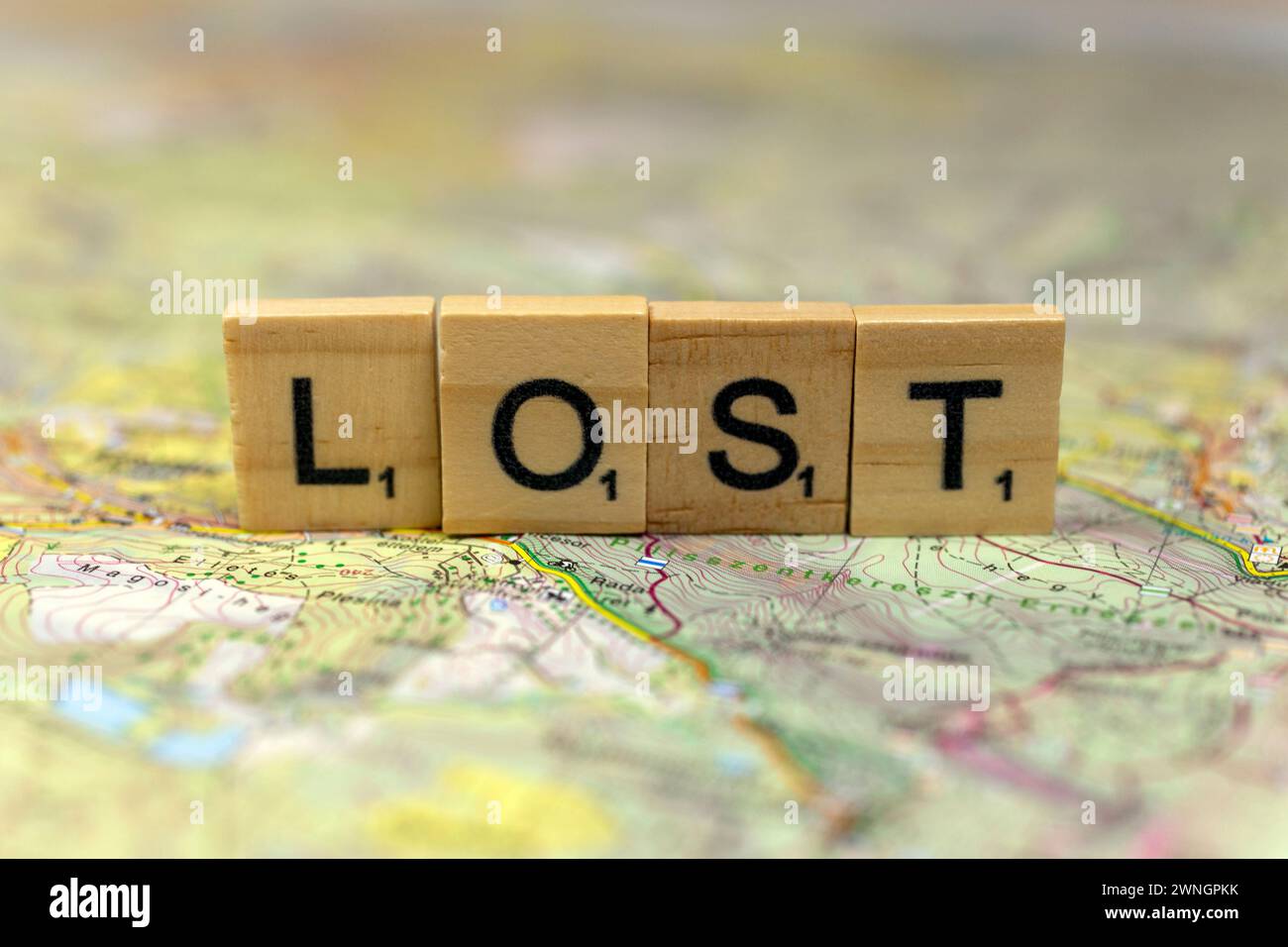 Lost wooden letters on an old paper map Stock Photo - Alamy
