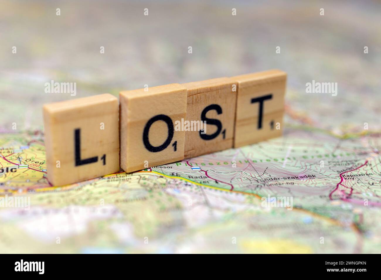 Lost wooden letters on an old paper map Stock Photo - Alamy