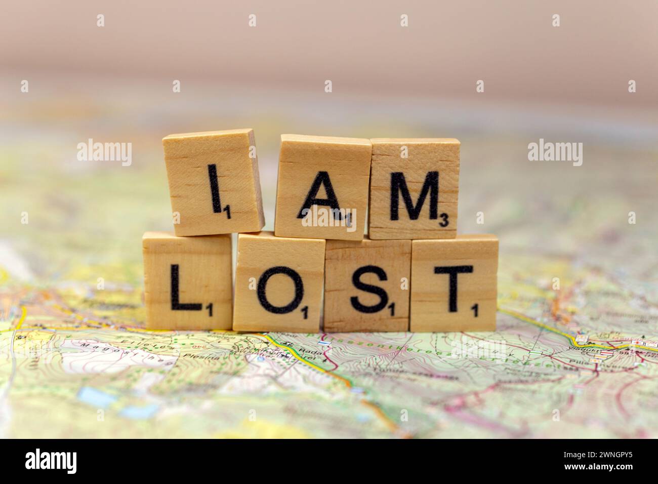 I am lost wooden letters on an old paper map Stock Photo - Alamy