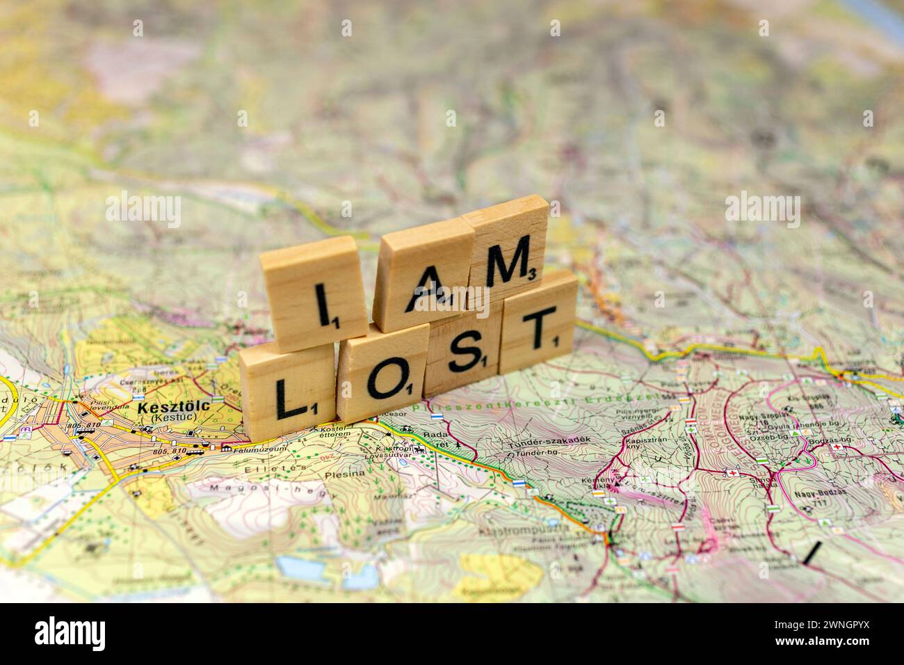 I am lost wooden letters on an old paper map Stock Photo - Alamy
