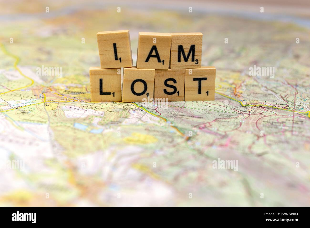 I am lost wooden letters on an old paper map Stock Photo - Alamy