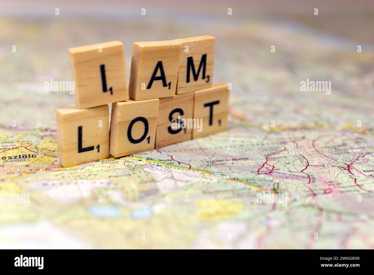 Lost wooden letters on an old paper map Stock Photo - Alamy