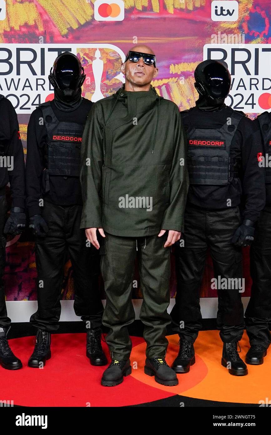 Casisdead, centre, poses for photographers upon arrival at the Brit ...