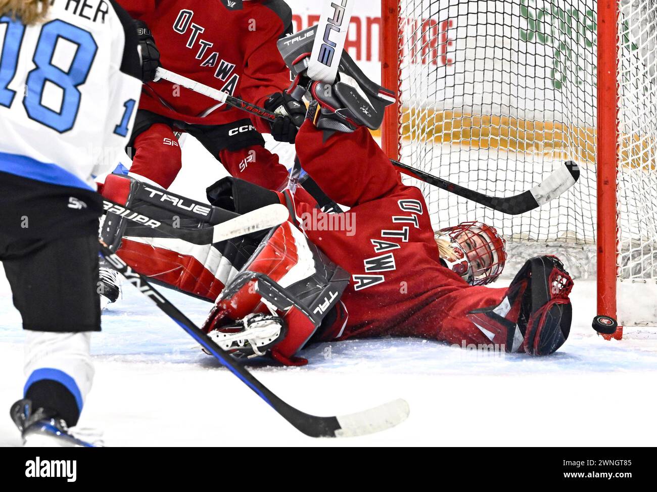 Ottawa's Emerance Maschmeyer (38) watches the puck as she makes a save ...
