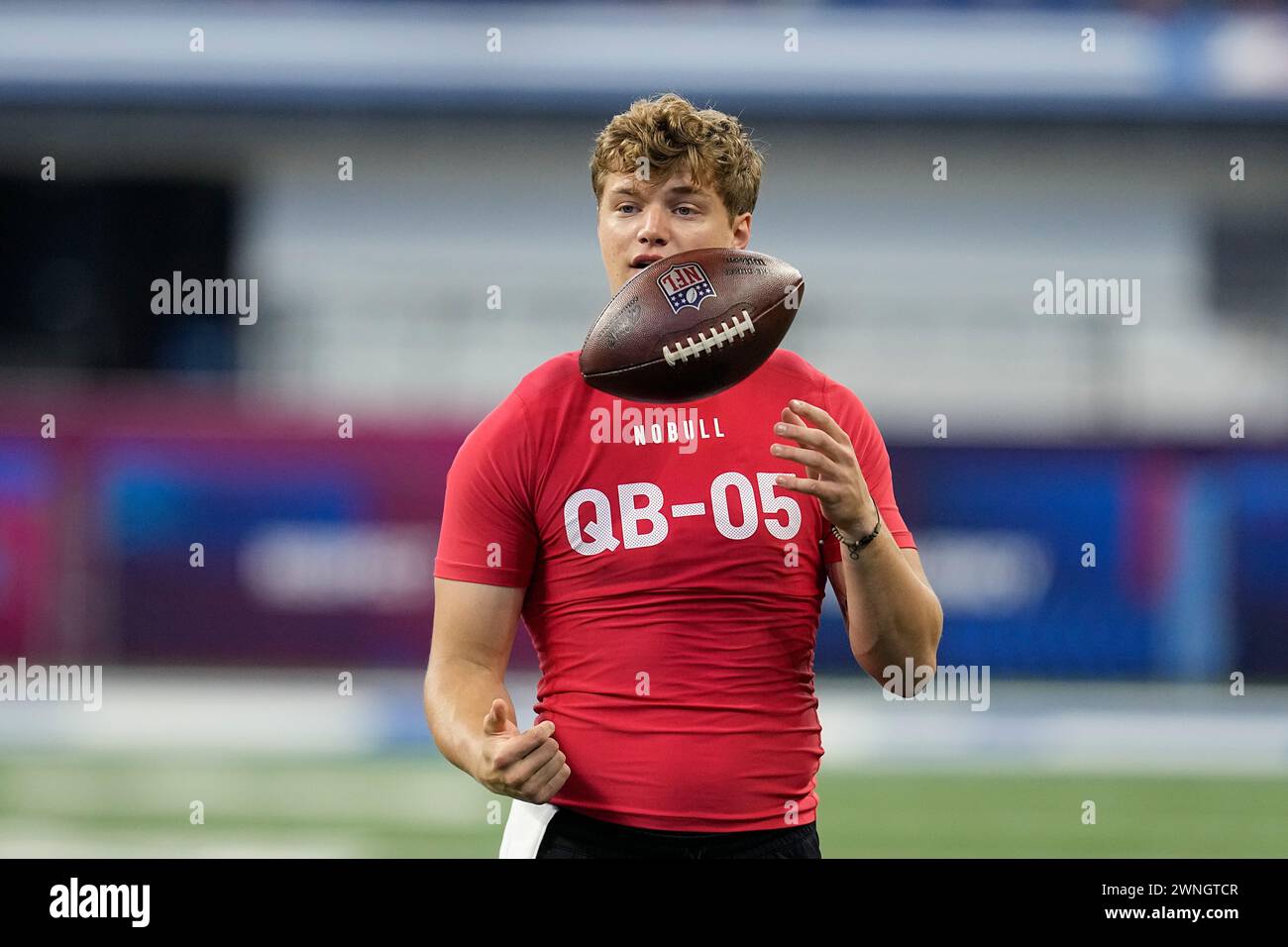 Michigan quarterback J.J. McCarthy runs a drill at the NFL football ...
